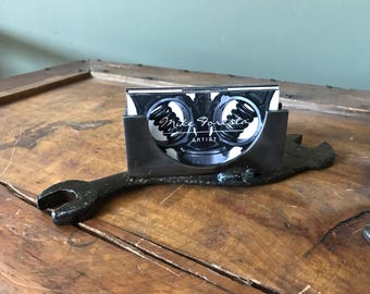 Hand crafted table lamp using repurposed engine/car parts.