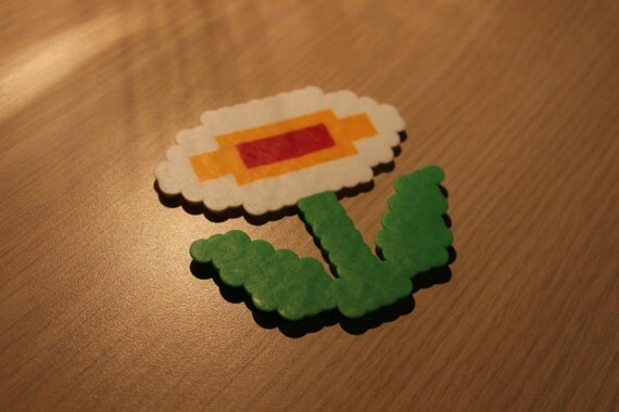 Fire Flower Pixel Art Sprite from Super Mario Bros