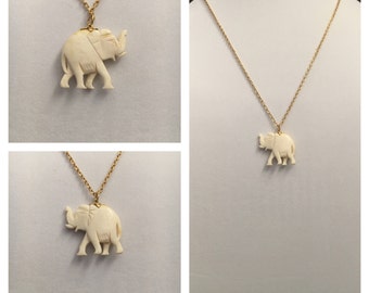 Faux ivory elephant | Etsy