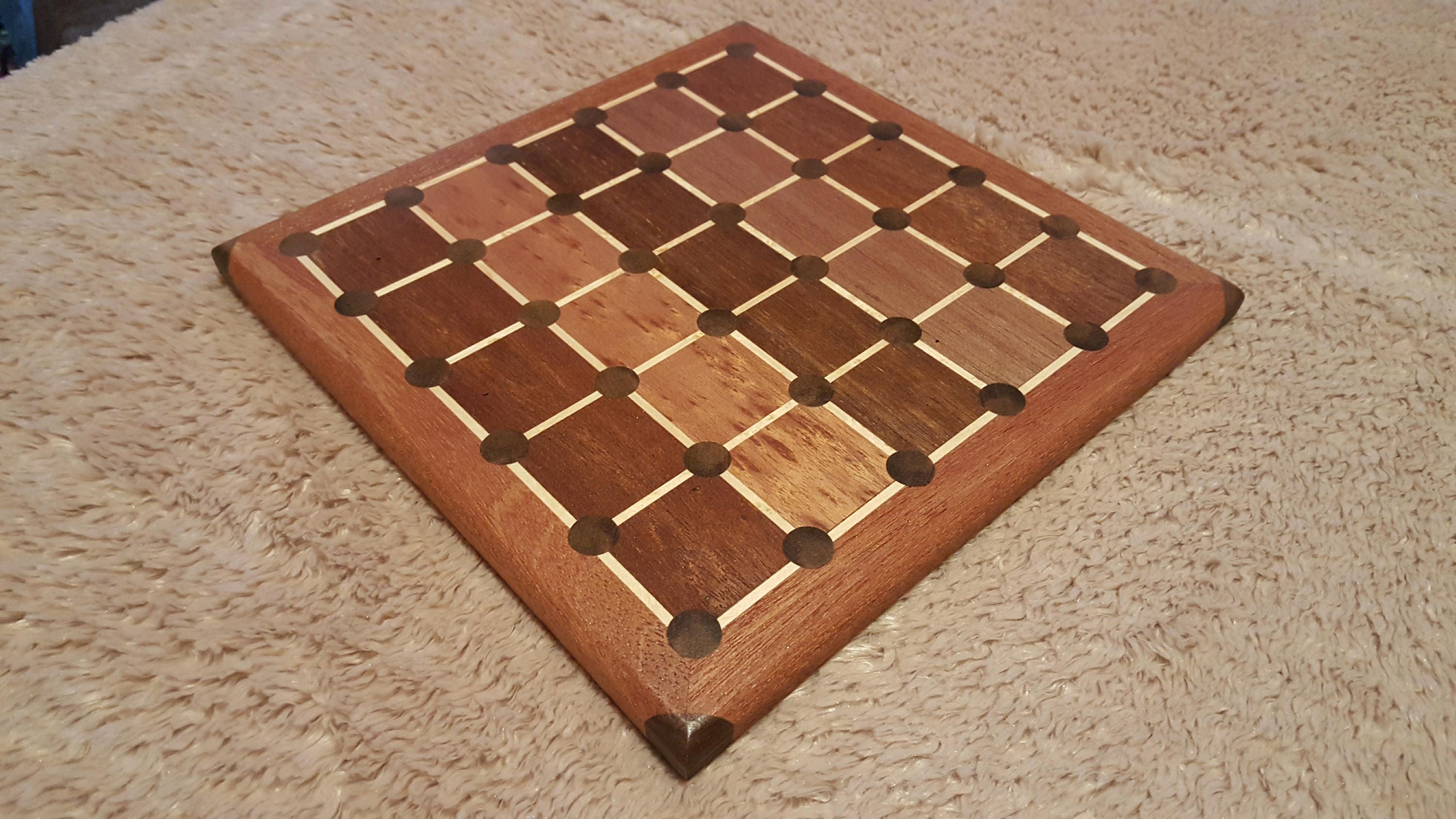 Tak board with game pieces