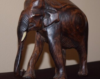 Carved wood elephant | Etsy