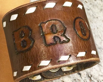 Items similar to Hand Tooled Leather Cuff with Silver Concho on Etsy