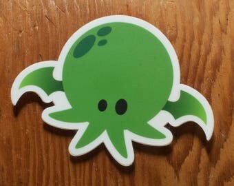 green Lovecraftian wooden box with likeness of Cthulhu on lid