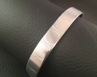 Embossed bracelet | Etsy