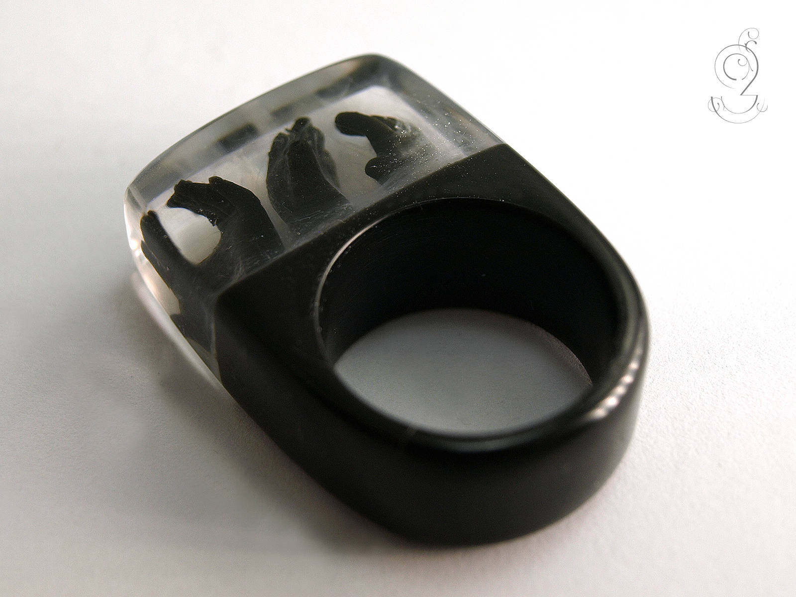 Zombie creepy undead ring with three black hands and fog on