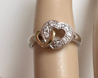 Intertwined hearts locked together forever