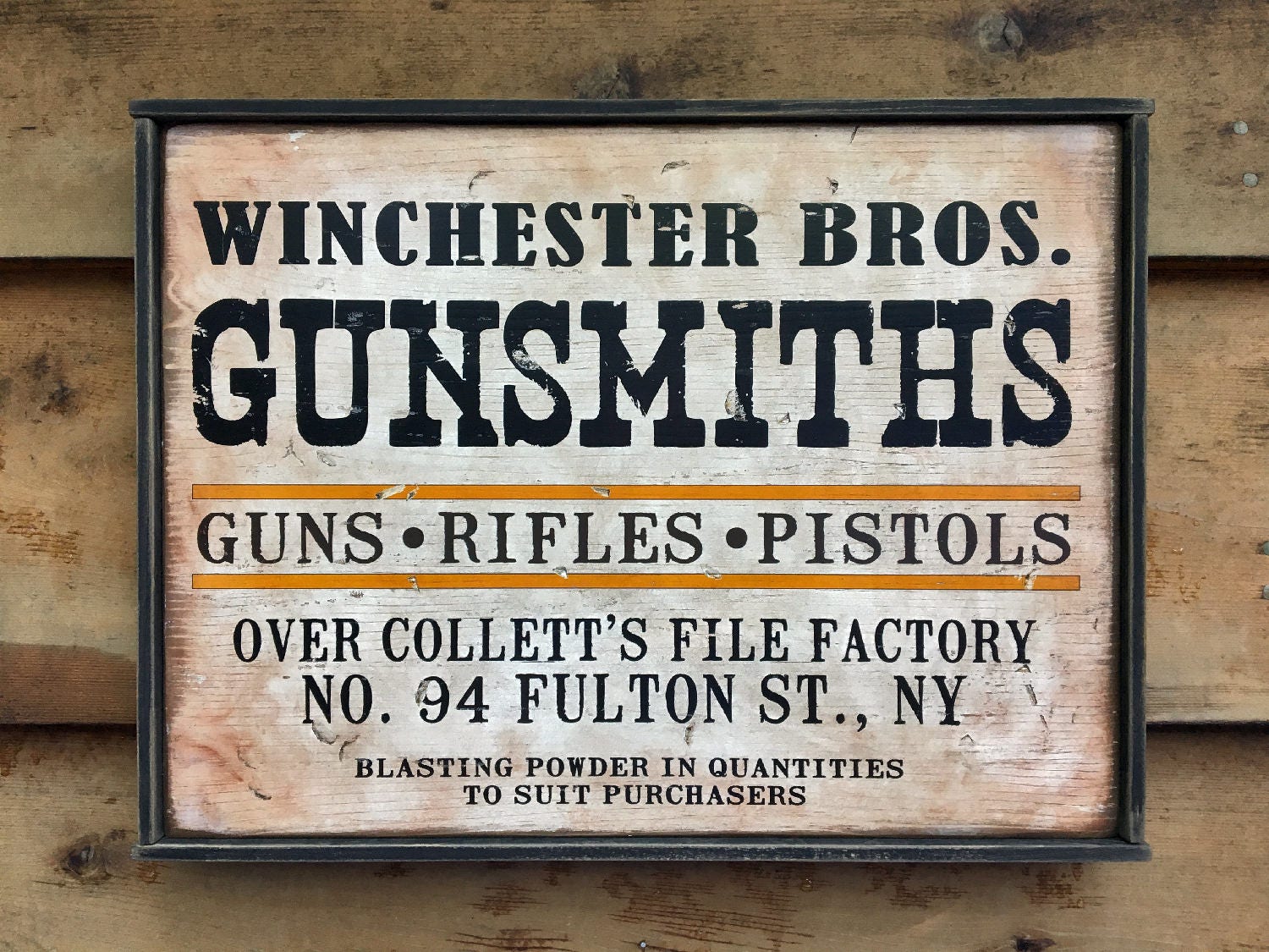 Rustic wooden sign 'Gunsmiths'